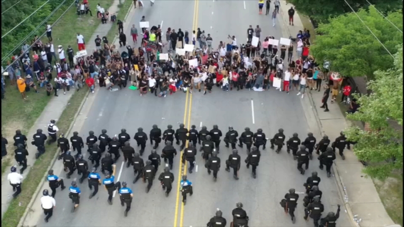 Trending Video: Police Kneel, Protest Ends With Hugs. - Daily Candid News